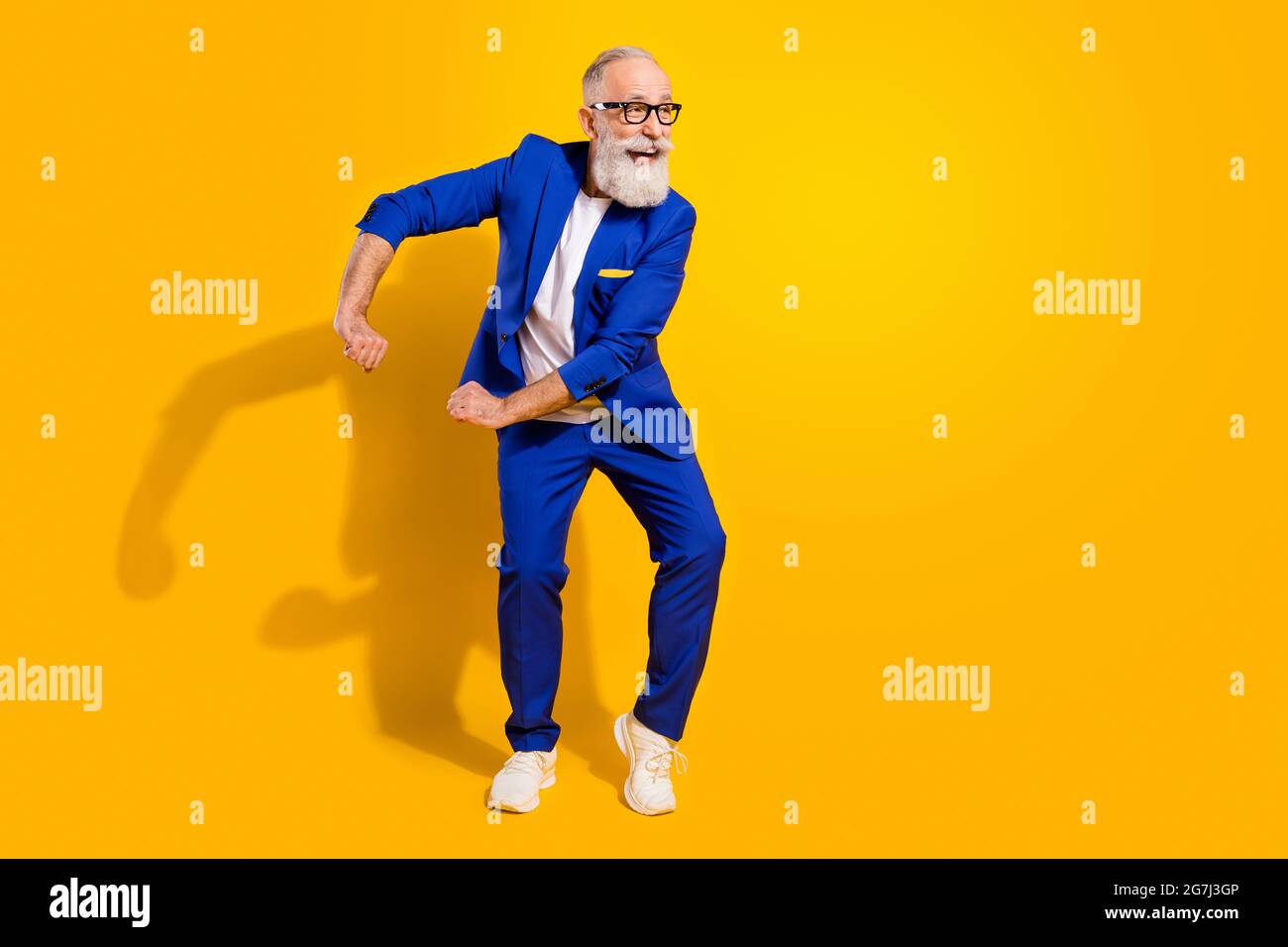 Full body photo of cheerful dreamy happy old man dance look empty space ...