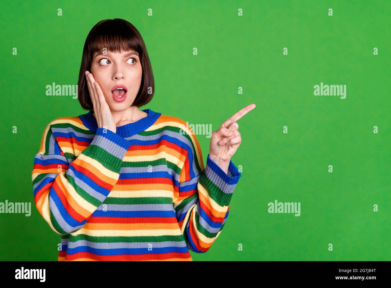 Photo of amazed shocked young woman look point finger empty space ...