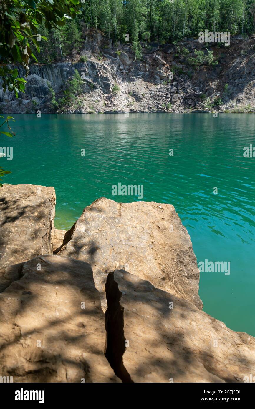 Old limestone quarry with green blue water Stock Photo - Alamy