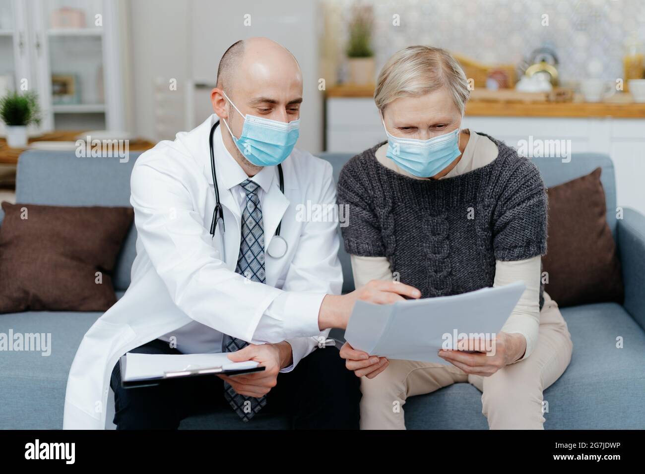 doctor and patient discussing an insurance contract Stock Photo - Alamy