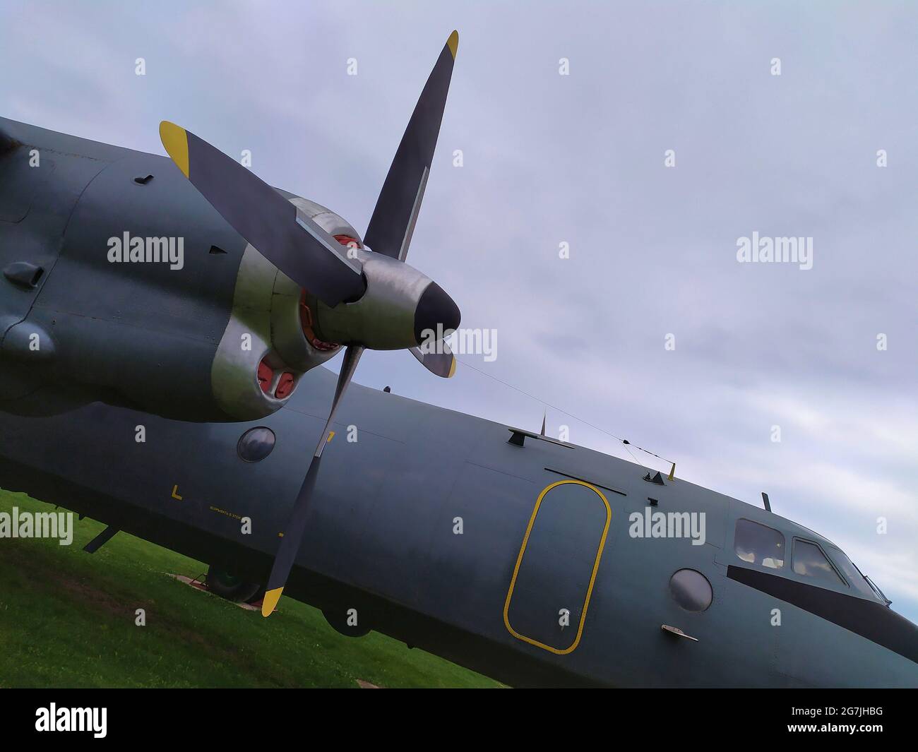Fuselage of gray airplane and wing with propeller Stock Photo - Alamy