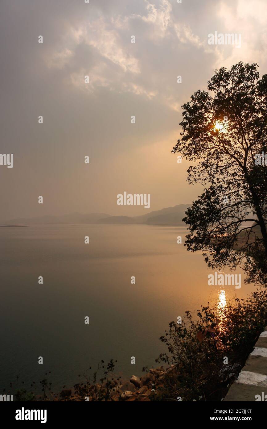 Sunset at Umiam Lake is a reservoir in the hills Stock Photo - Alamy