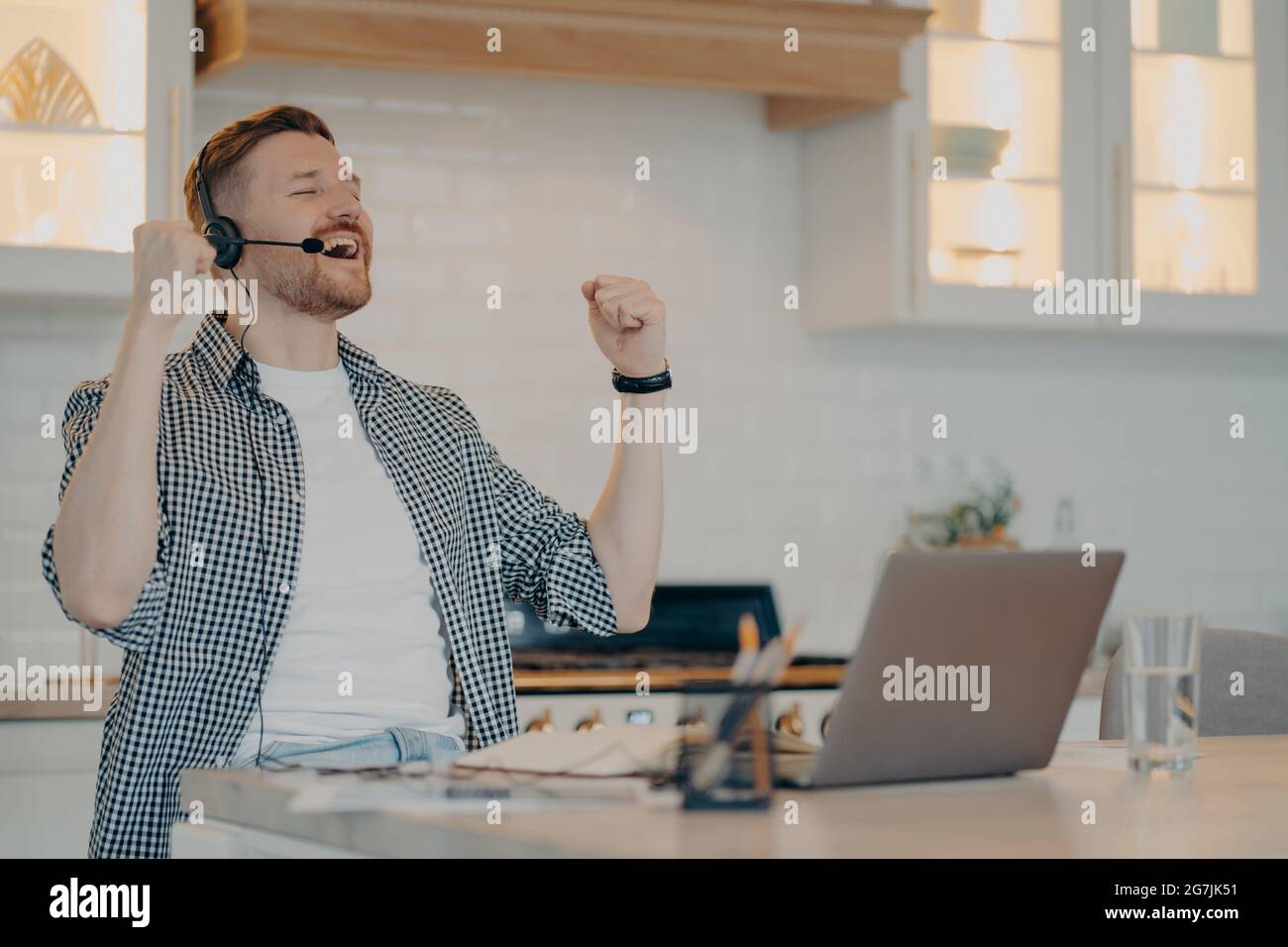 Joyful male worker feeling excited and enjoying success Stock Photo - Alamy