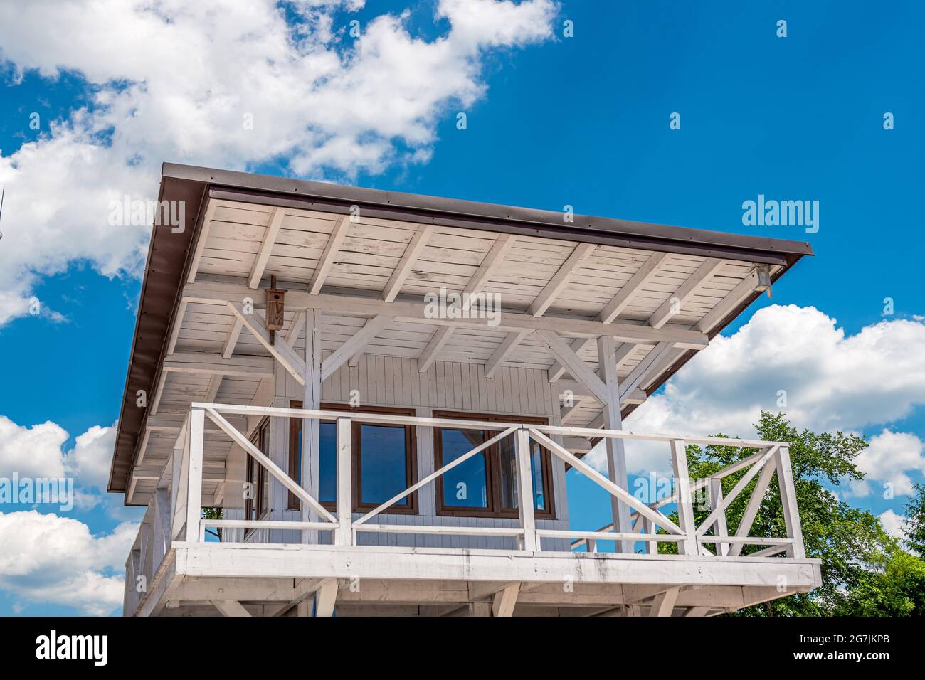 White lifeguard booth against blue, cloudy sky Stock Photo - Alamy