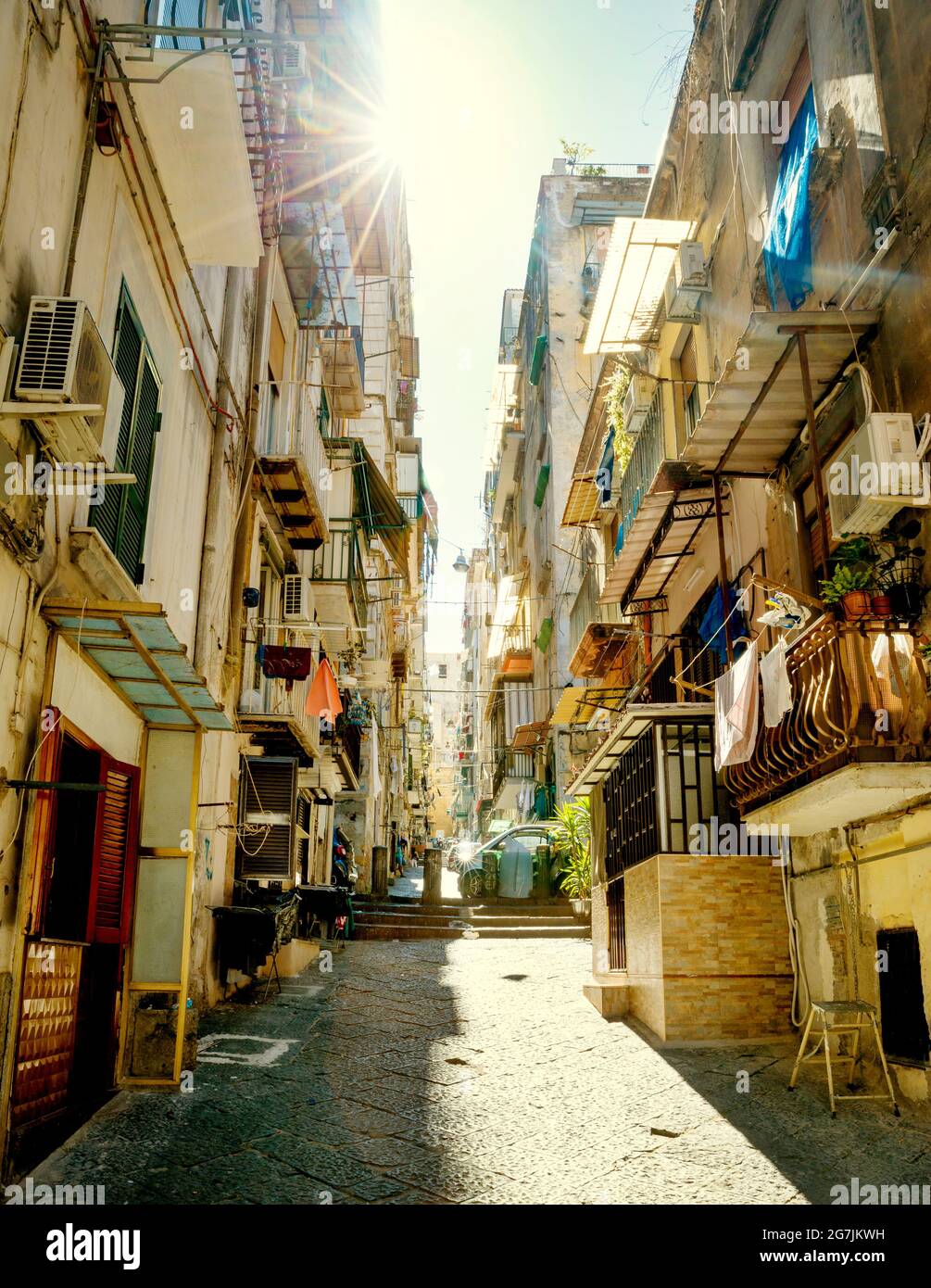 Narrow street in old town of Naples city in Italy Stock Photo - Alamy