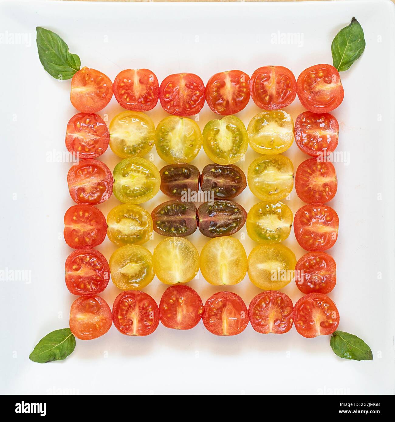 Different varieties of cherry tomatoes served in salad isolated on ...