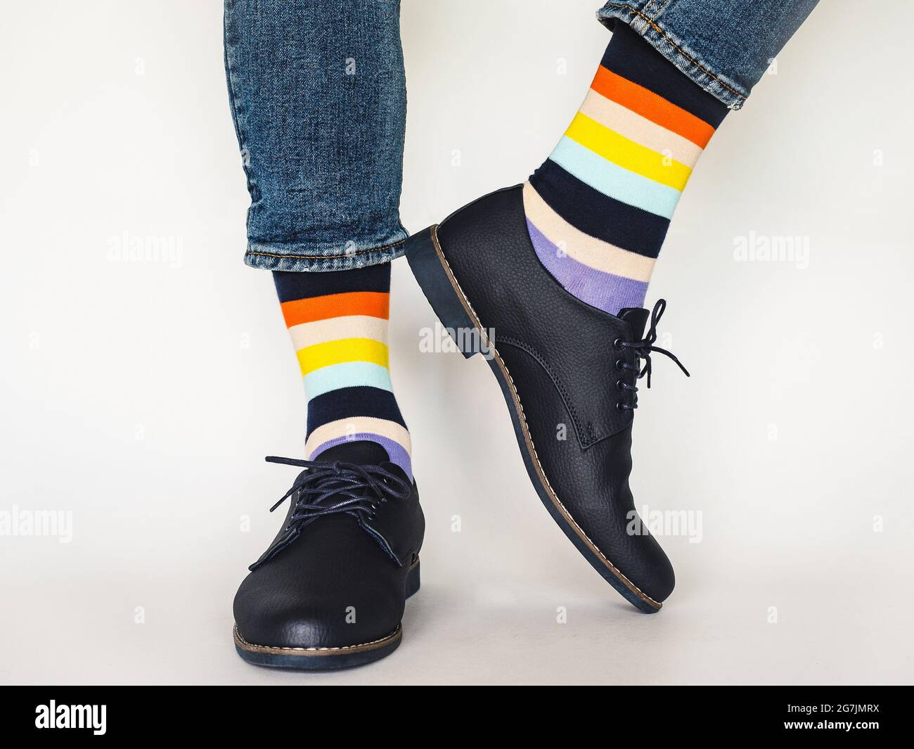 Men's legs, trendy shoes and bright socks. Close-up. Style, beauty and ...