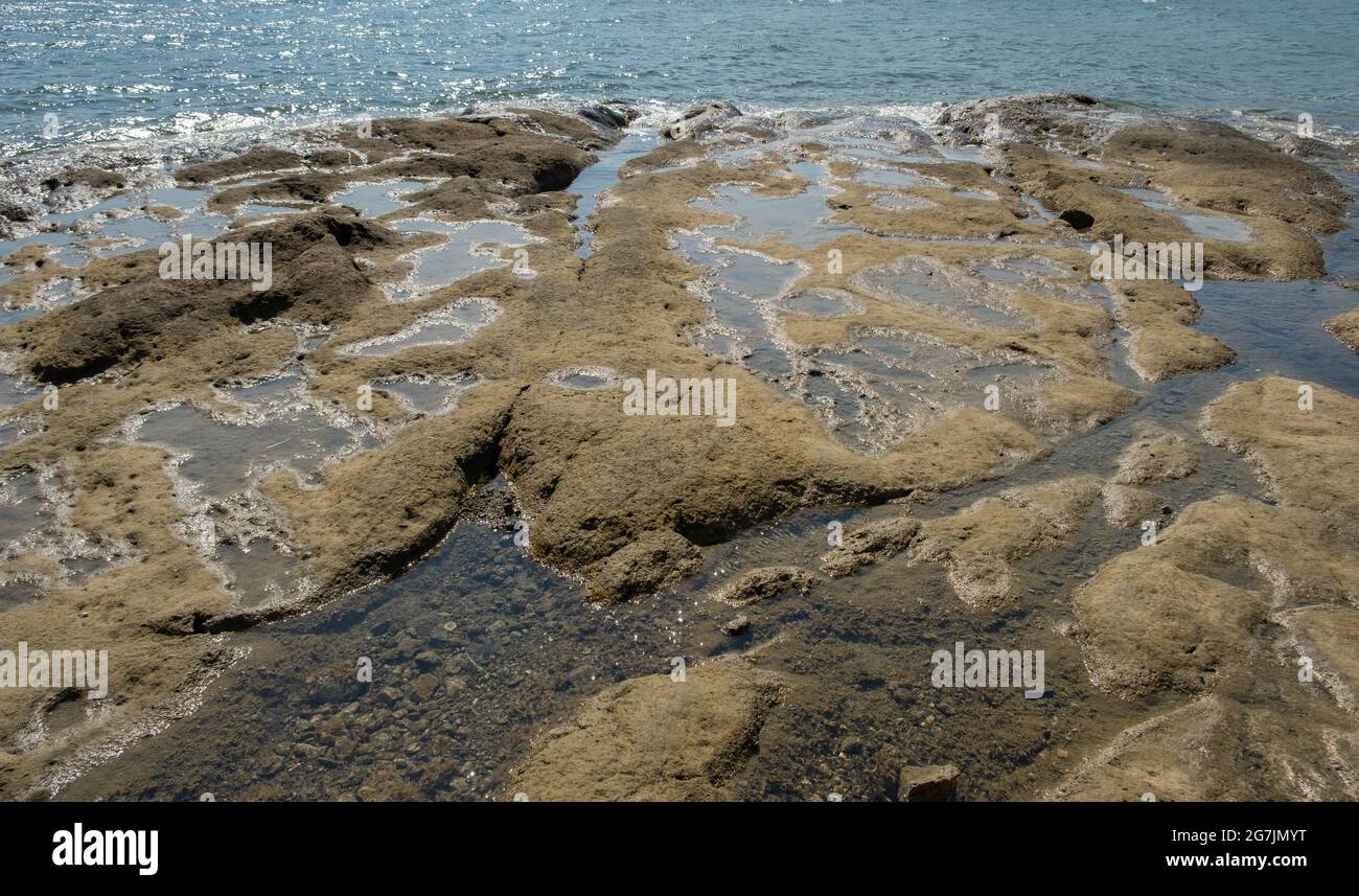 sea rocks filled with water Stock Photo - Alamy
