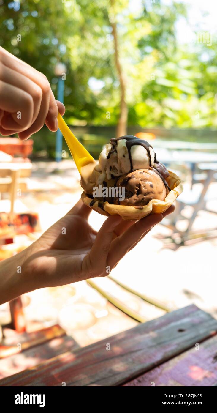Person eating ice cream hi-res stock photography and images - Alamy