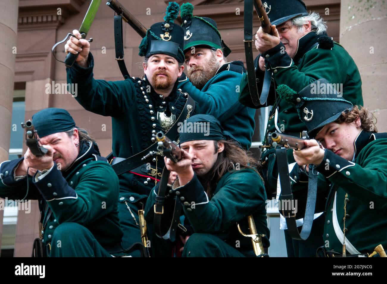 A group of reenactors in the uniform of the 95th Regiment of Foot in ...