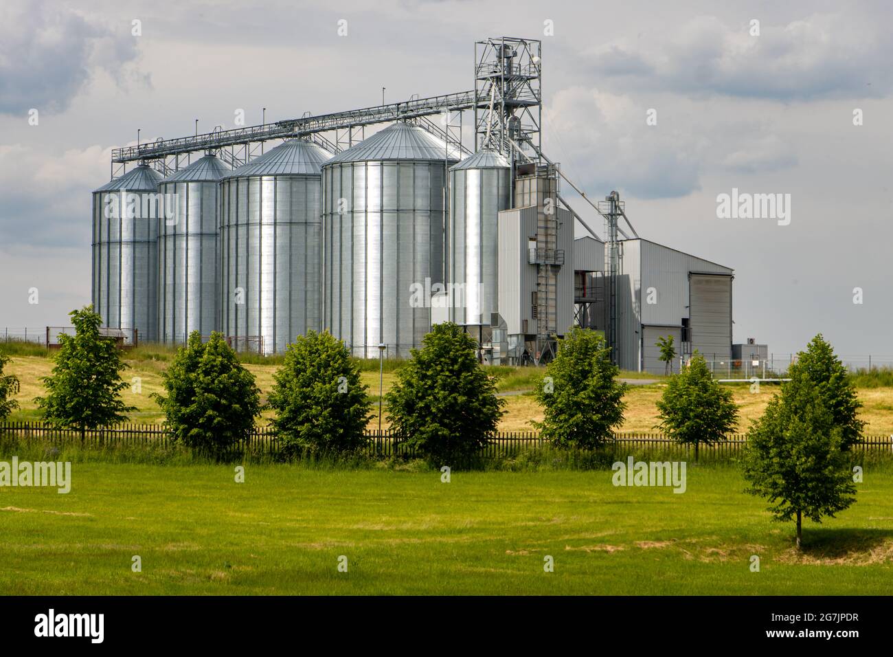 Farm silo for storing cereals in the countryside Stock Photo - Alamy