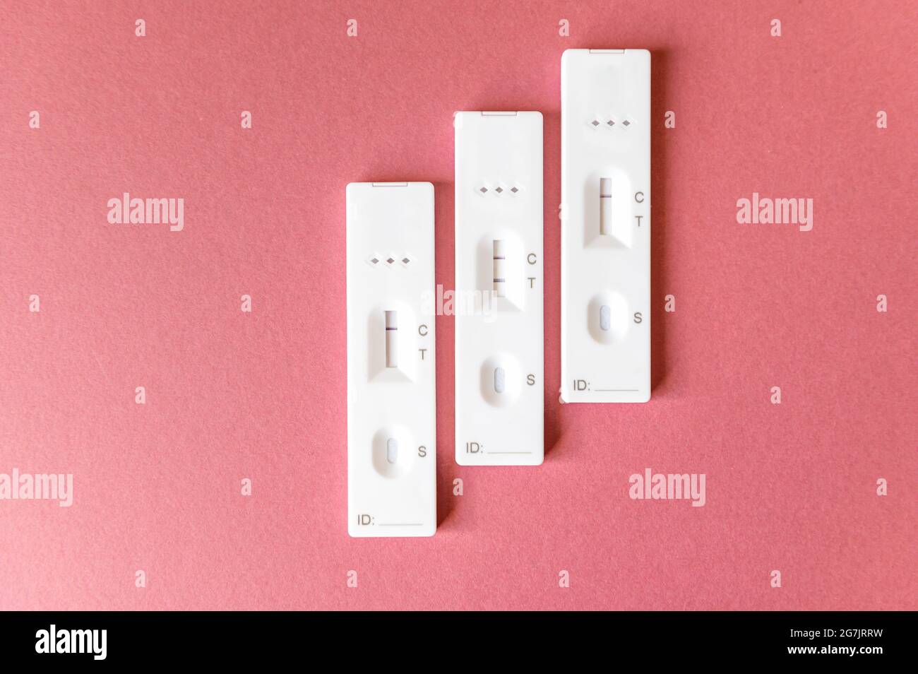 Positive and negative rapid lateral flow COVID 19 tests Stock Photo - Alamy