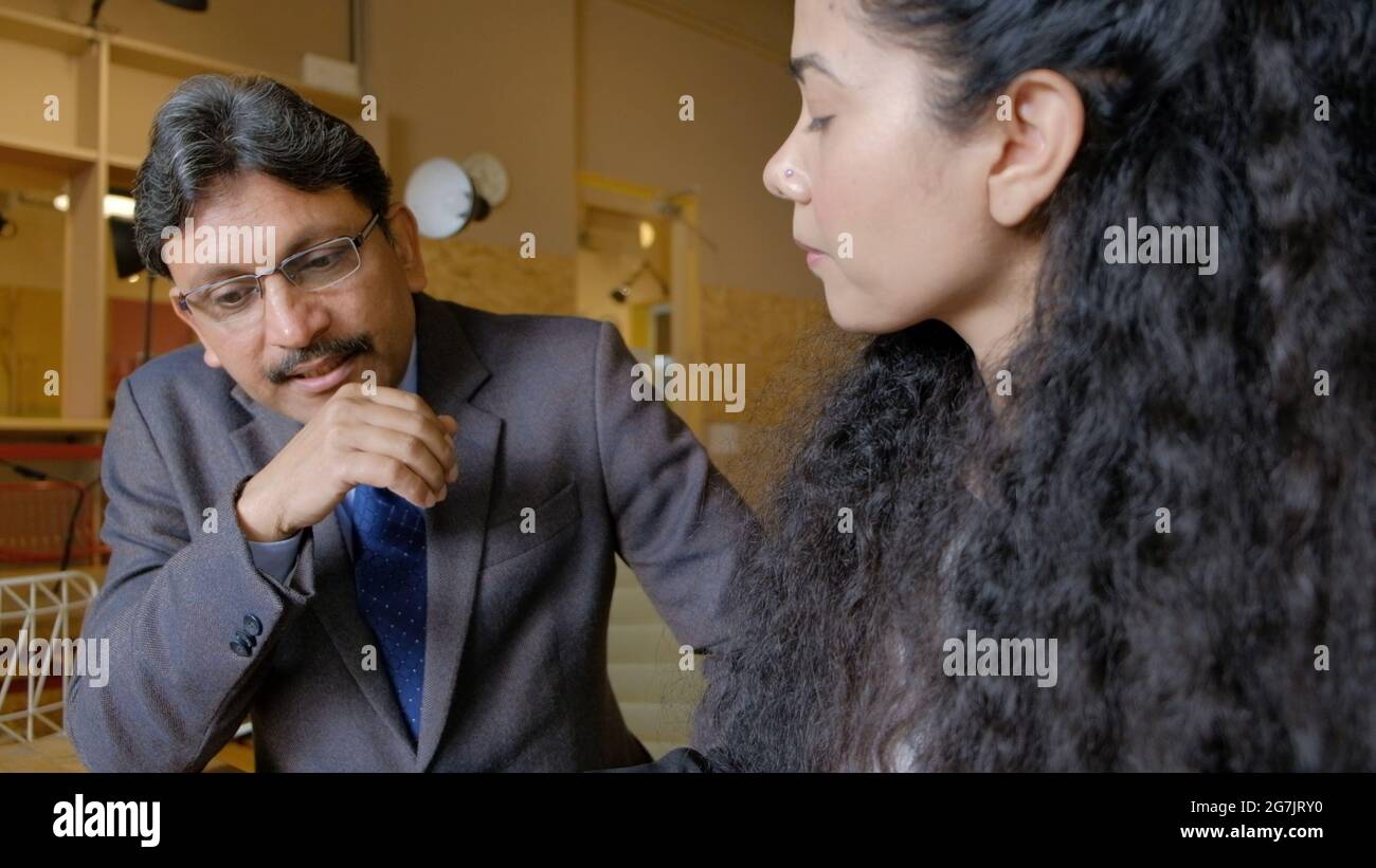 Indian colleagues having a discussion at office Stock Photo - Alamy