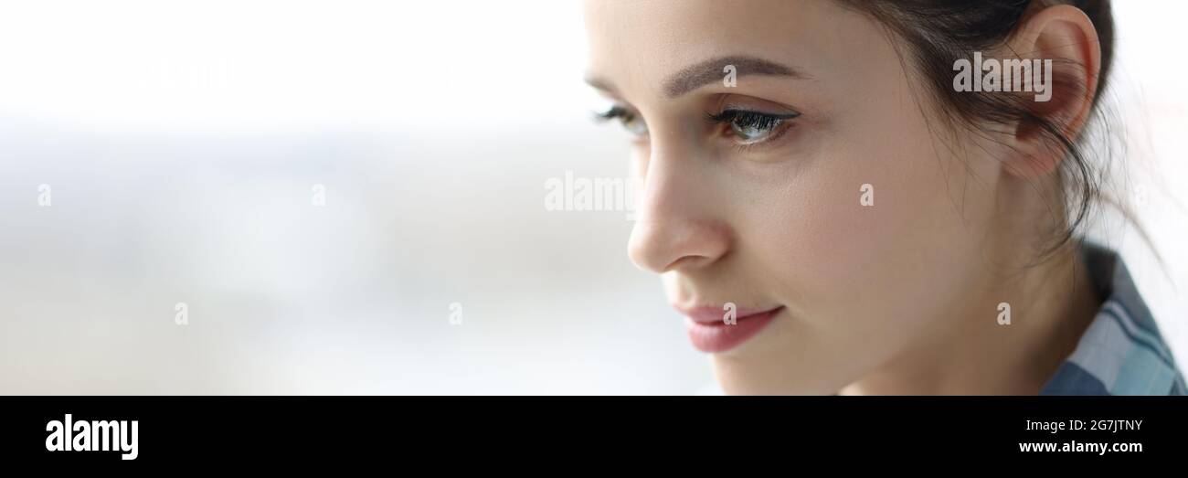 Portrait of young upset woman near the window Stock Photo - Alamy