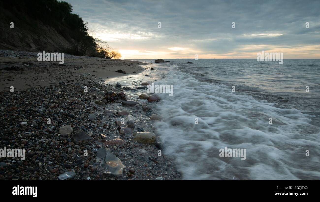 Nice beach during sunrise Stock Photo - Alamy