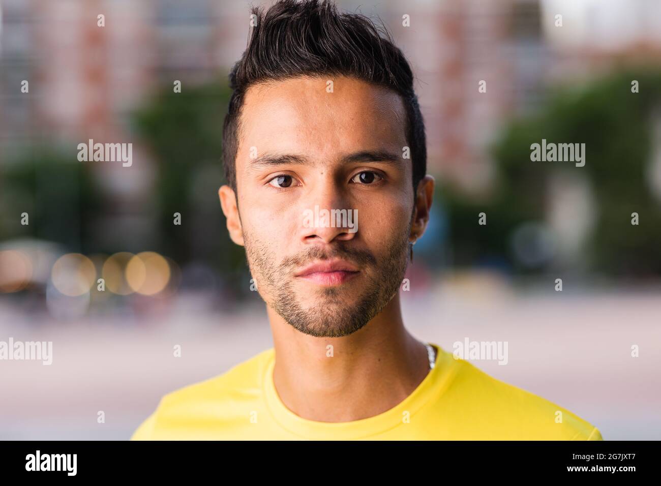 Young latin man headshot. Colombian isolated hispanic portrait in urban ...