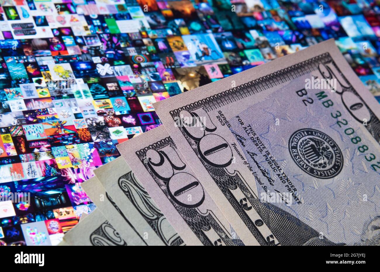 Money placed on ipad screen with Beeple EVERYDAYS: THE FIRST 5000 DAYS ...