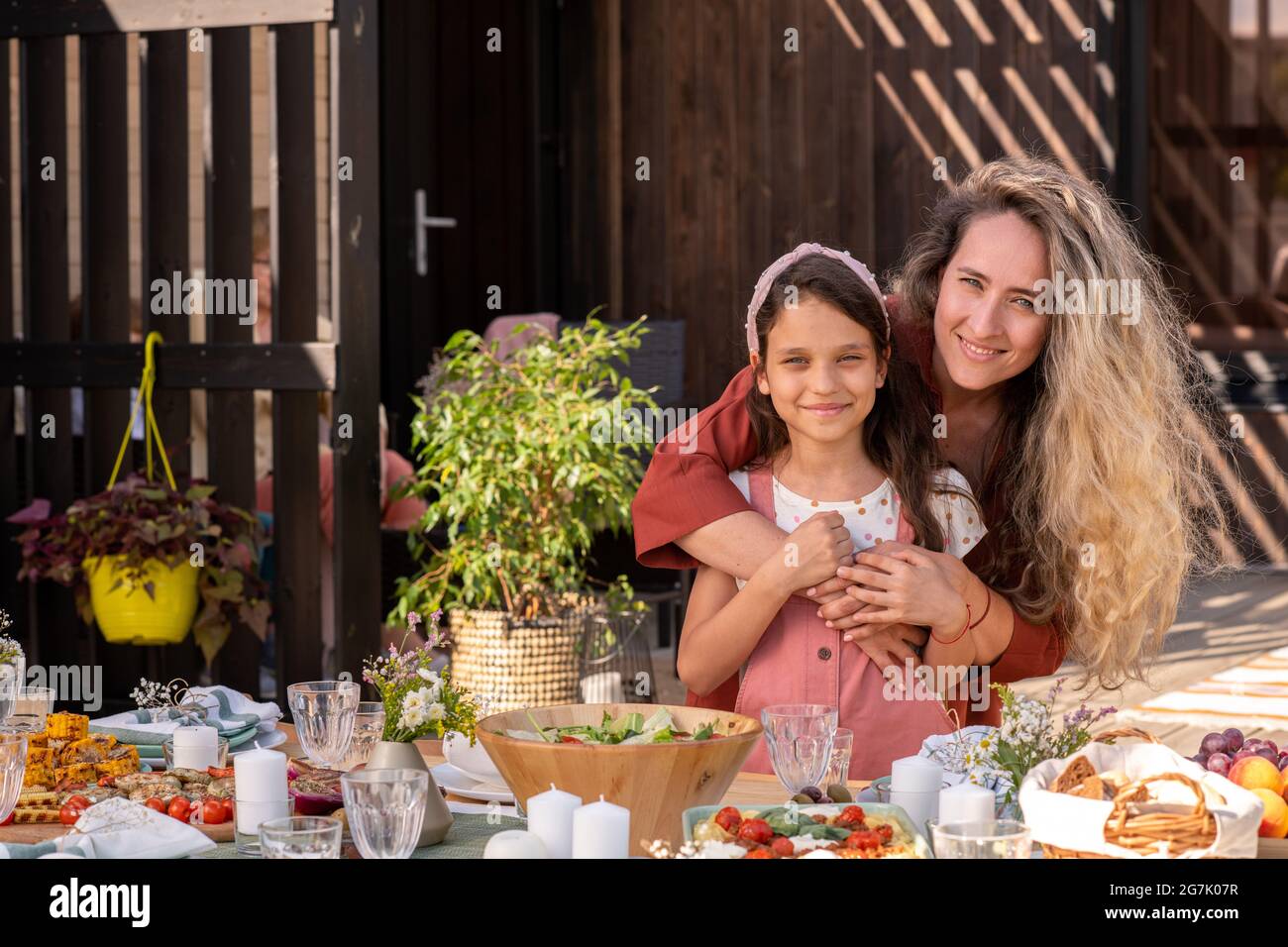 Daughter hugging mother from behind hi-res stock photography and images ...