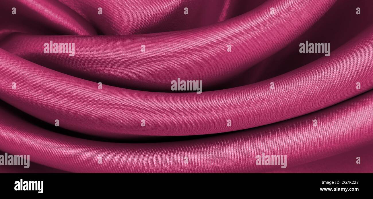 Smooth elegant pink silk or satin luxury cloth texture can use as abstract background. Luxurious ...