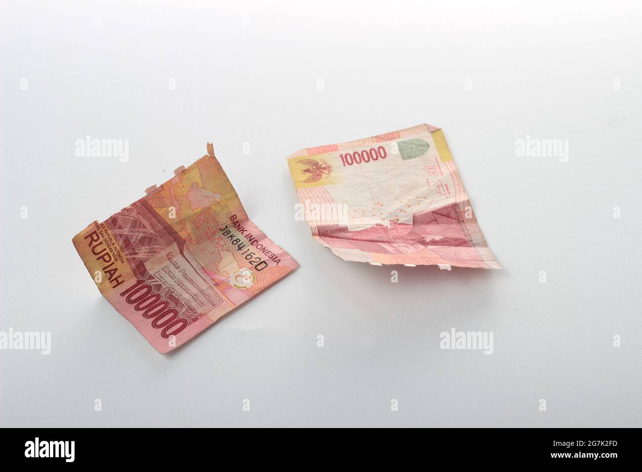 Conceptual Photo Rupiah Paper Money, Torn or Broken 100000, Top View at ...
