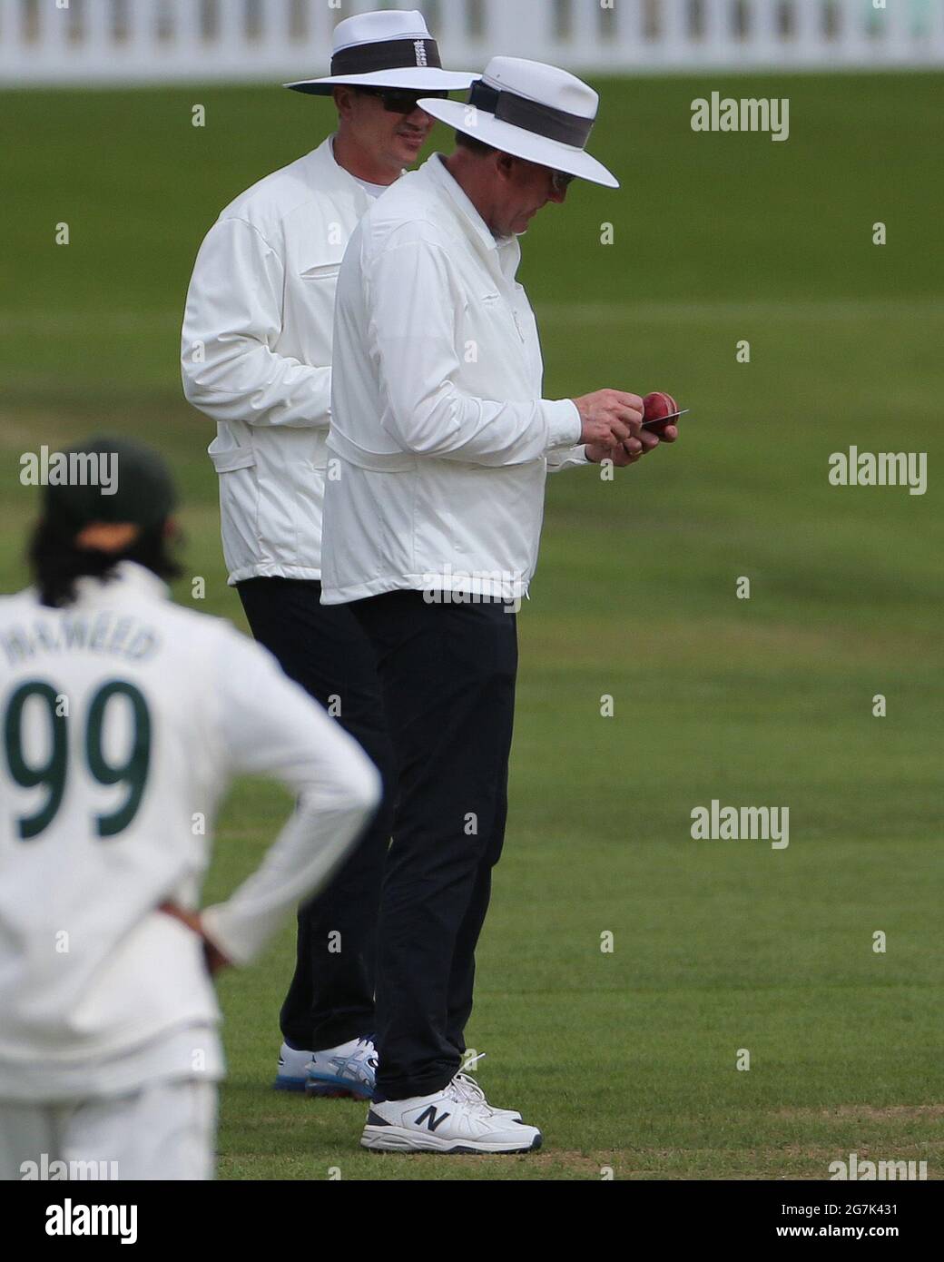 CHESTER LE STREET, UK. JULY 14TH Umpire Rob Bailey checks the ball with ...