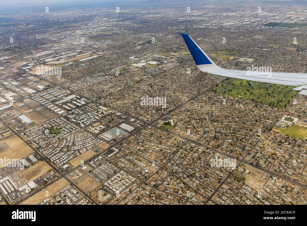 Flight on an airplane over mix of residential, Industrial city Phoenix ...