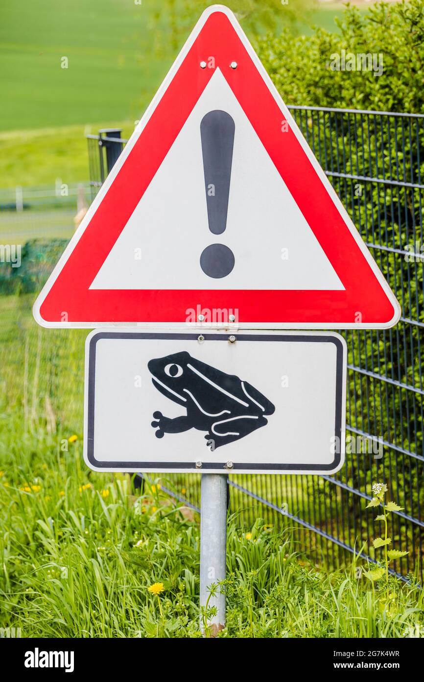 Frog warning sign with black frog icon on white background in red ...