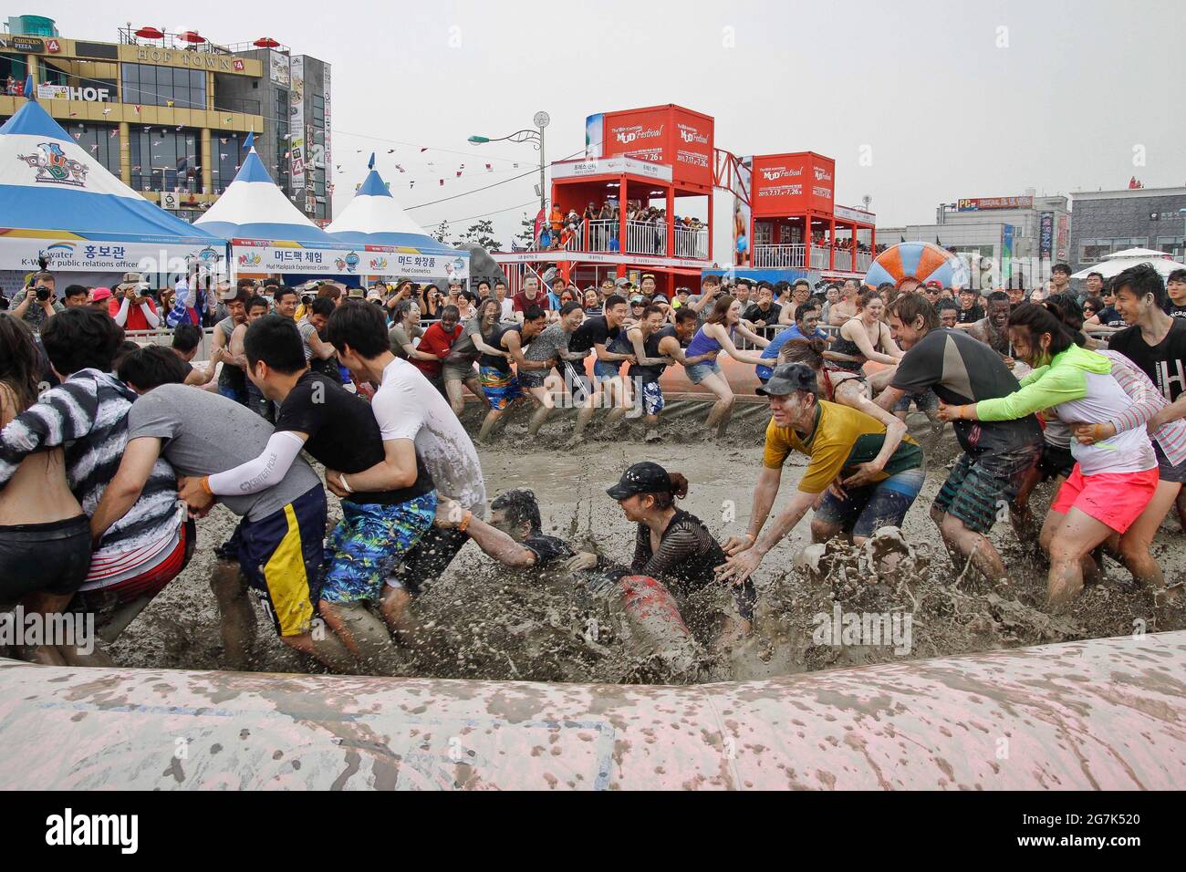 July 15, 2021-Boryeong, South Korea-A Visitors enjoying wrestle in the ...