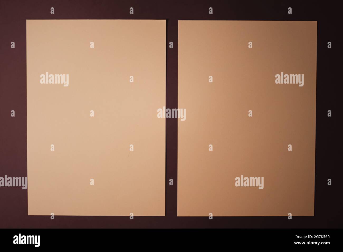 Blank A4 paper, beige on dark background as office stationery flatlay ...