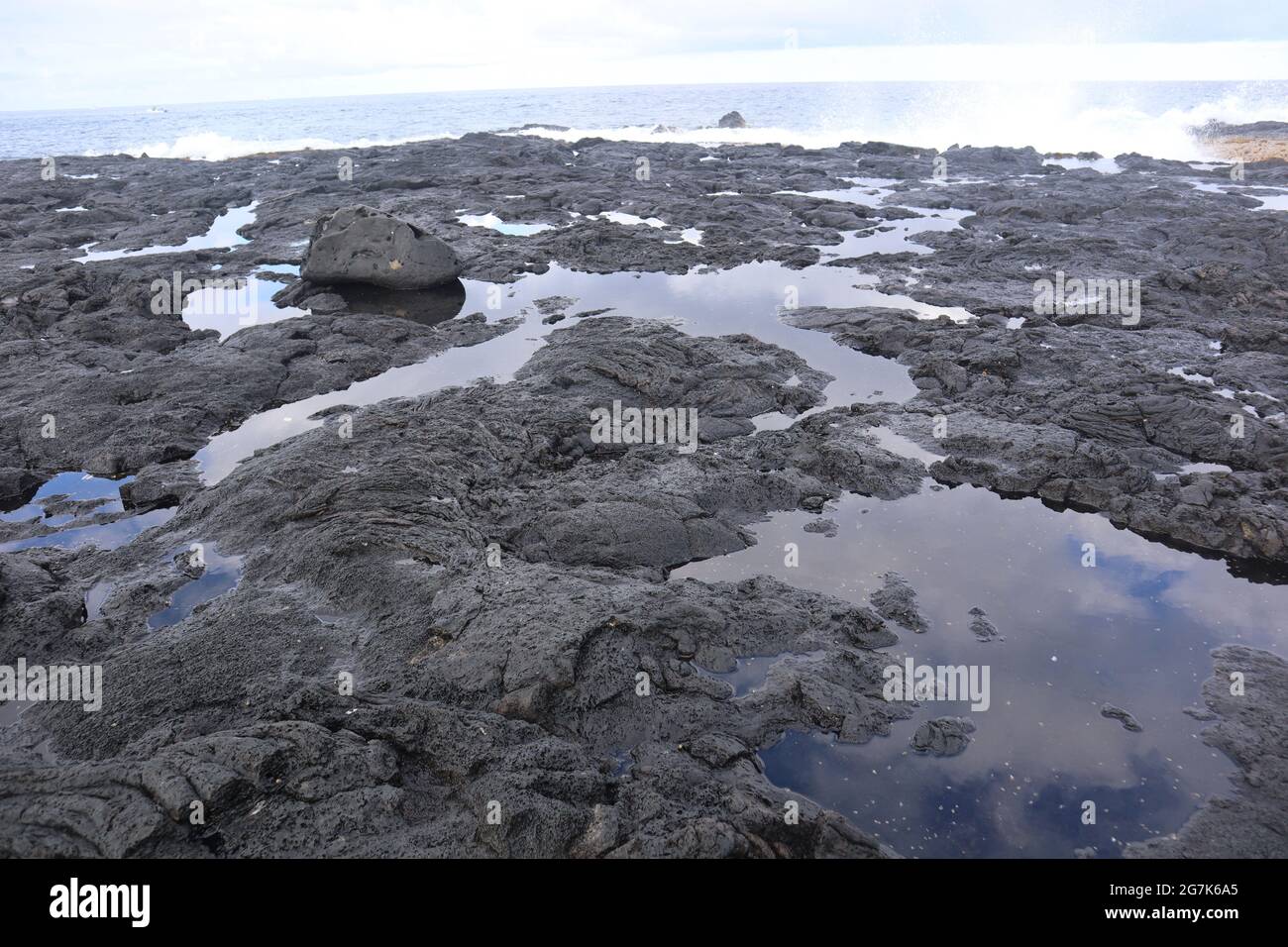 Oceanside landscape of black volcanic rock on the island of Kona ...