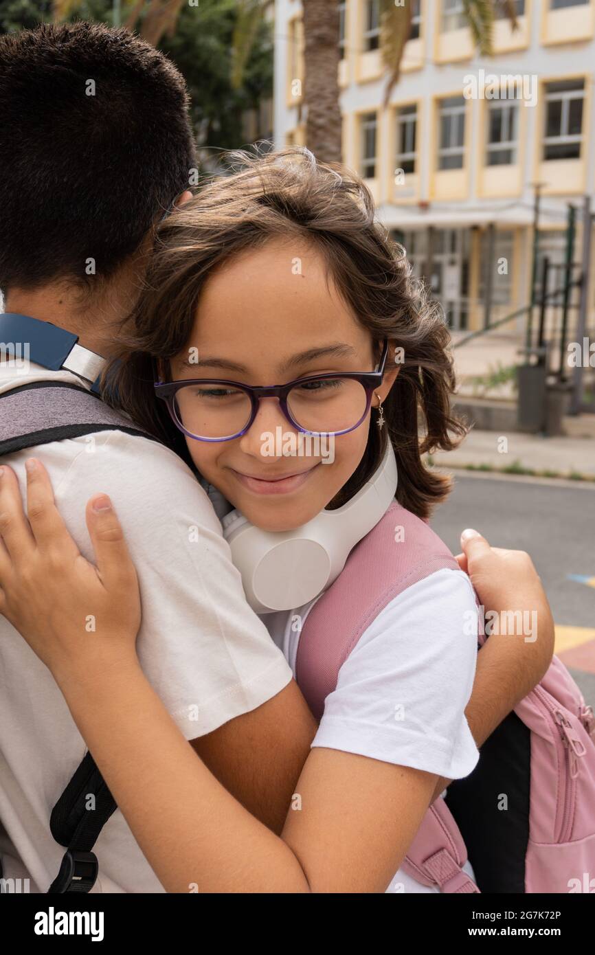 Hug friends greet hi-res stock photography and images - Alamy