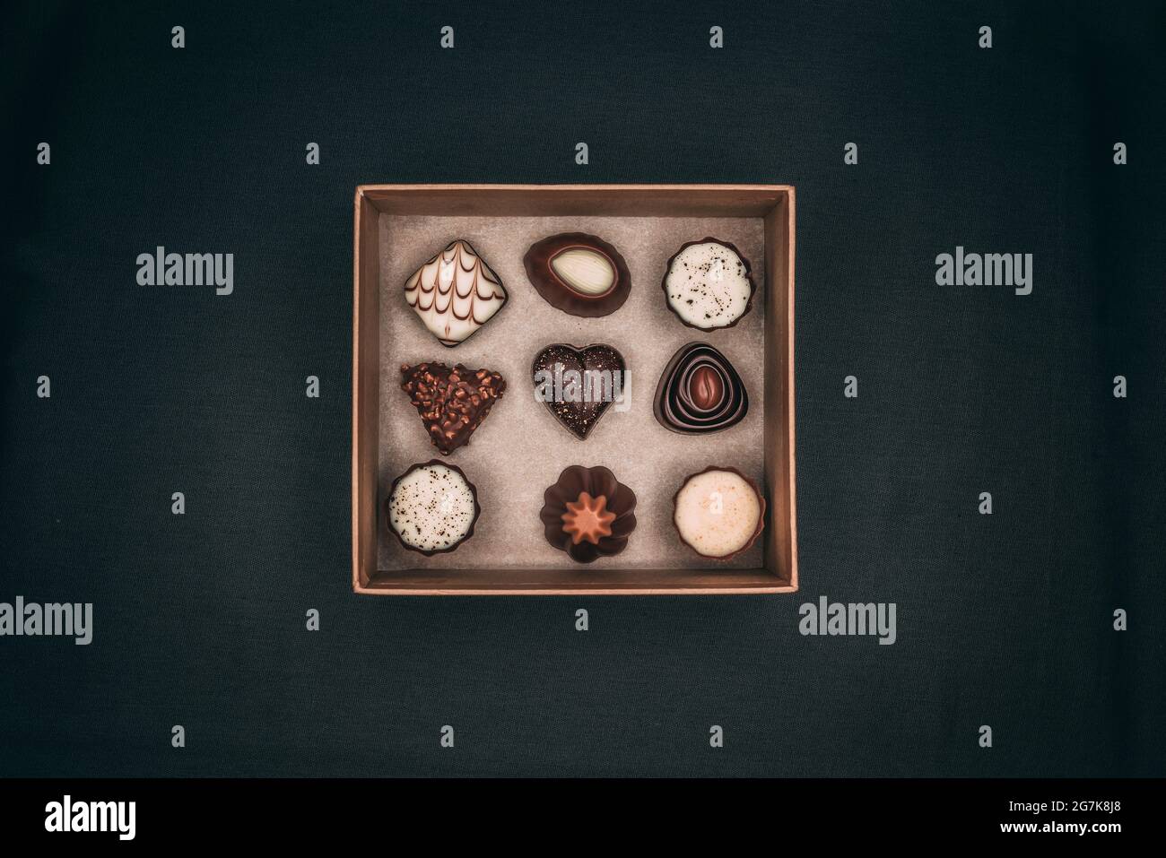 Closeup of a box with chocolate on the black background. Top view Stock ...