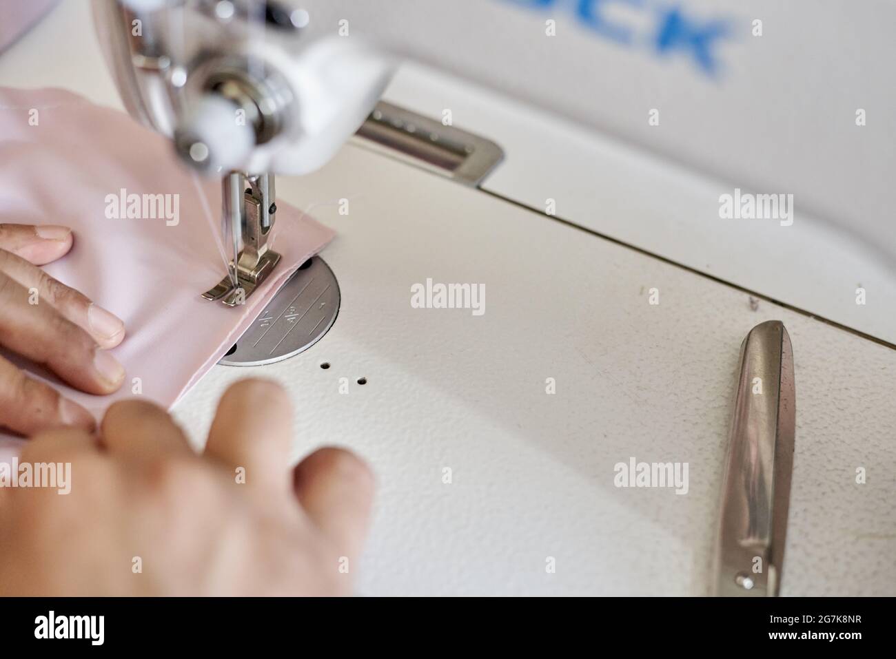 Closeup shot of a sewing process in the phase of overstitching Stock ...