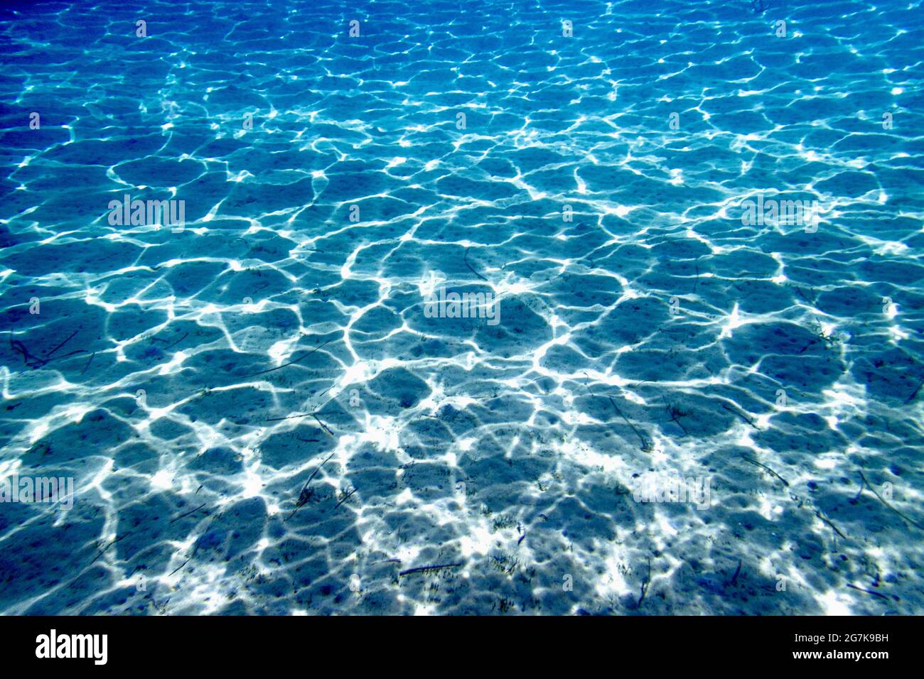 Sun rays penetrating through the pure sea water Stock Photo - Alamy