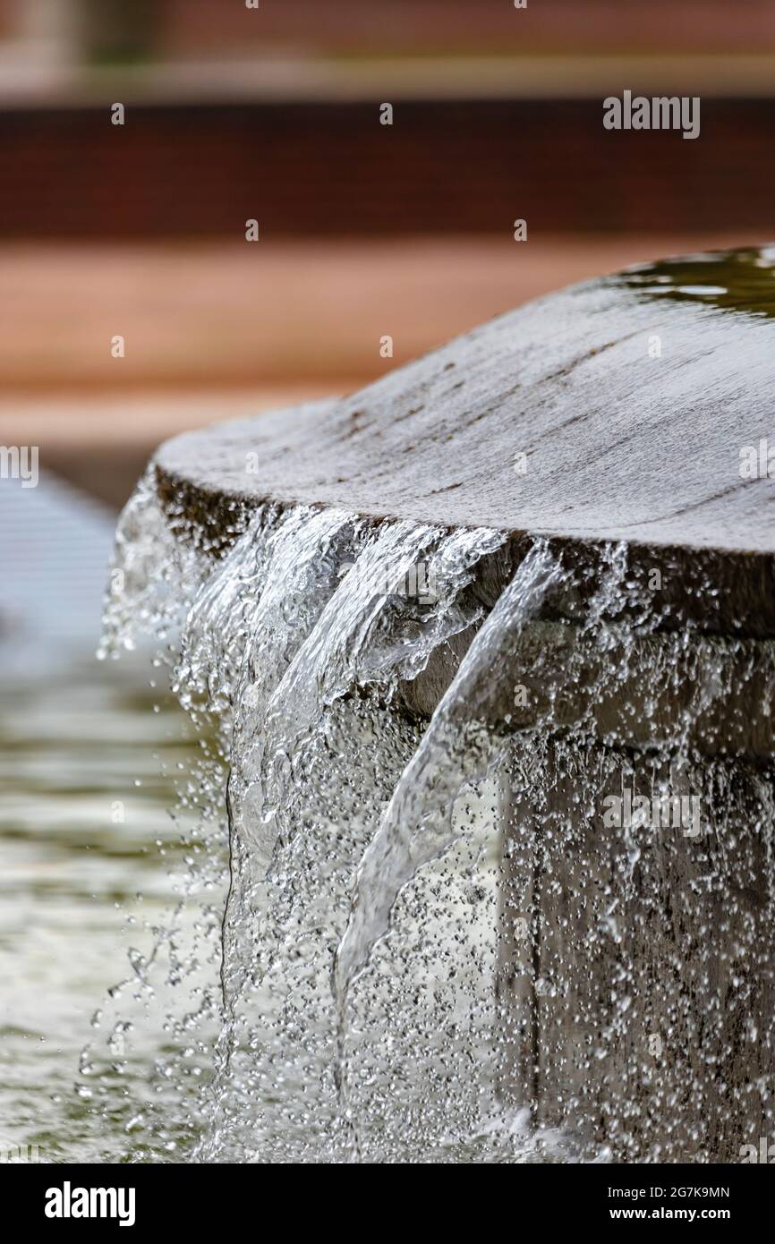 Fountain splashing water in a park Stock Photo - Alamy