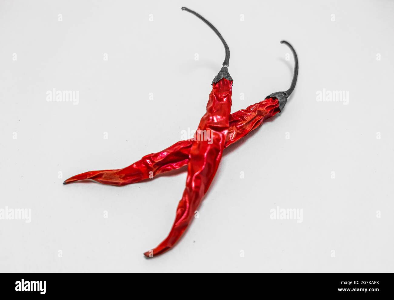 Couple of red dried chili cayenne pepper isolated on white background ...