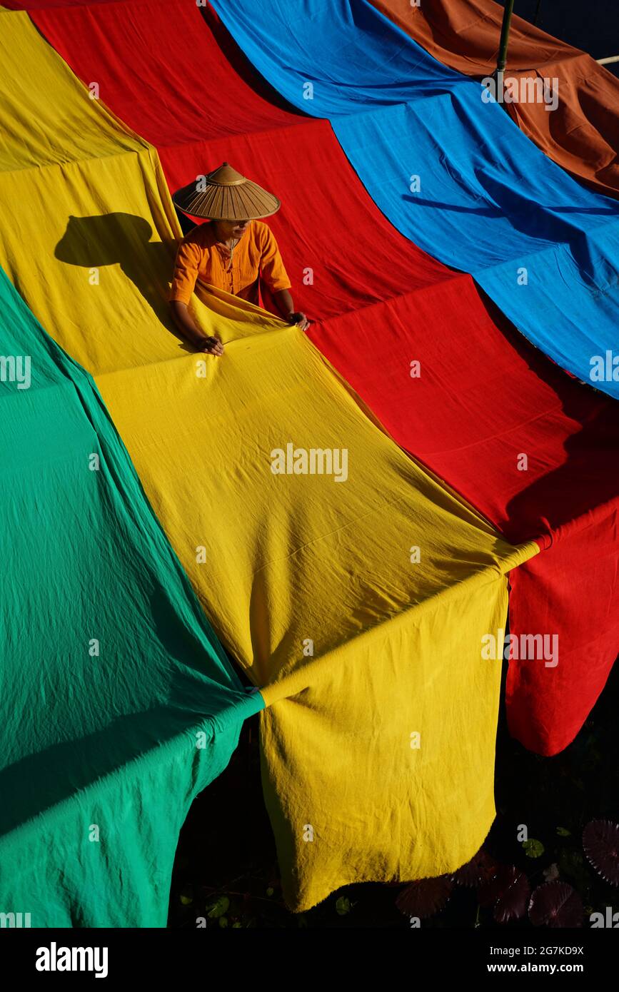 Colorful clothes in Inle lake Myanmar Stock Photo - Alamy