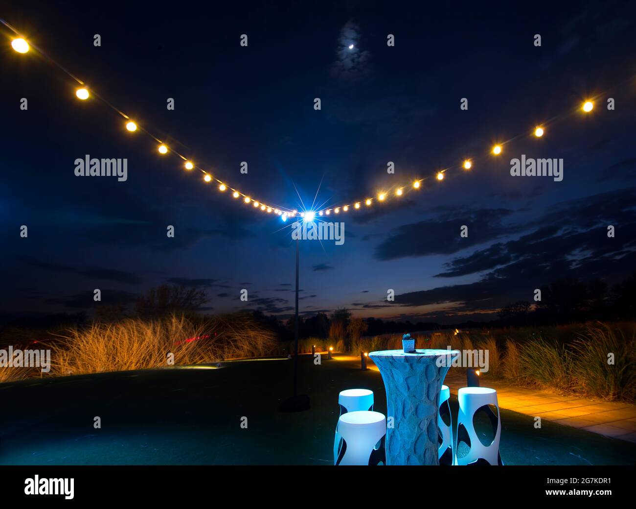 An outdoor event setup under the night sky at a resort in Central ...