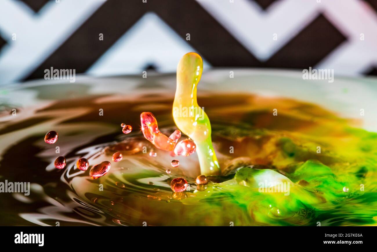 A water drop rebounding from a pool of water to create a beautiful ...