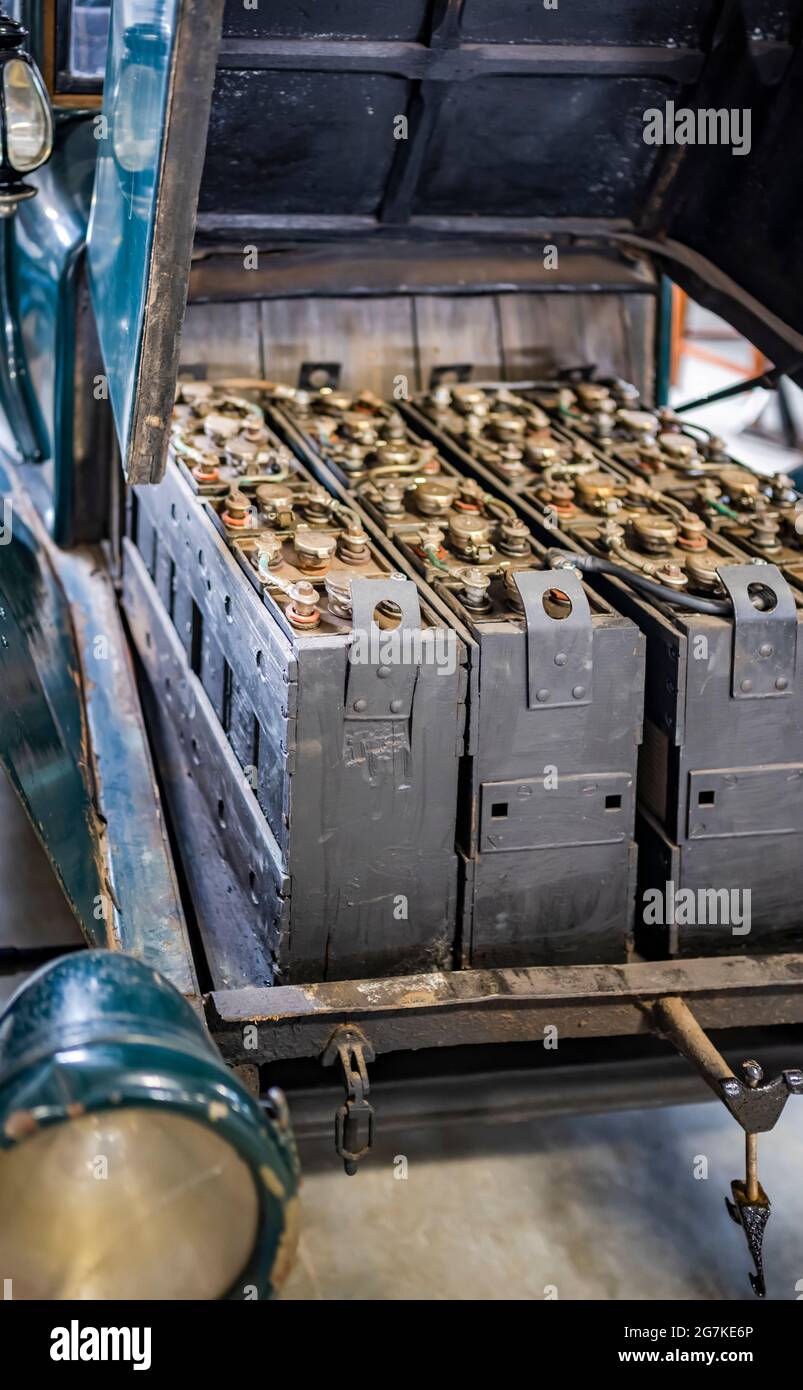 Retro electric car with an open hood with a set of rechargeable ...