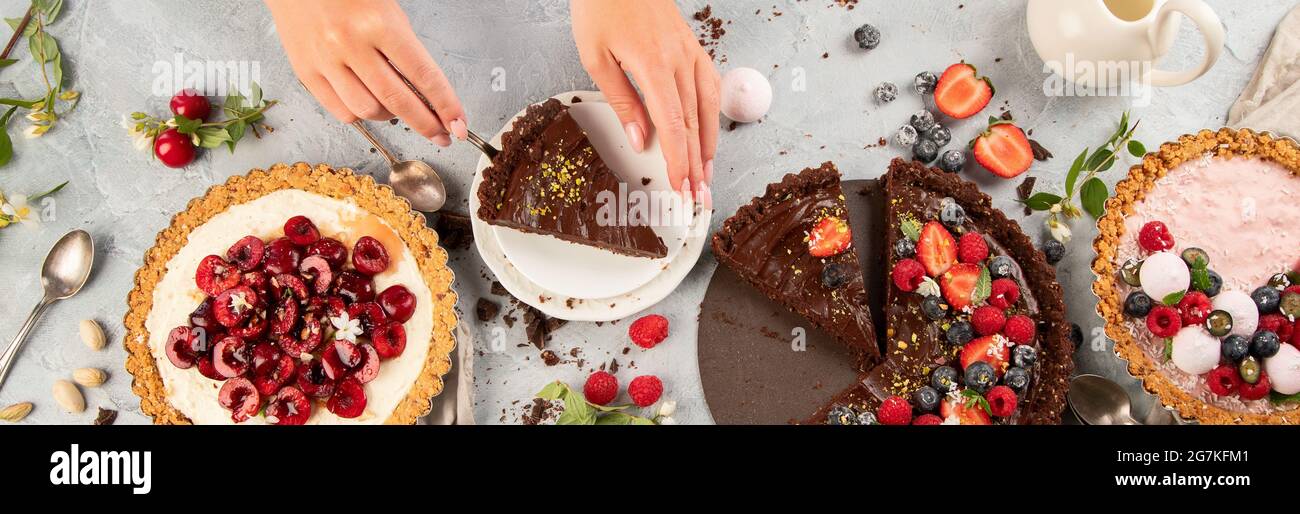 Different types of homemade tarts on light gray background. Top view ...