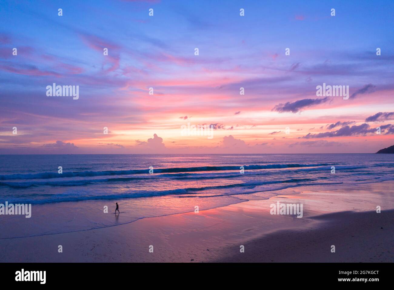aerial view reflection of sweet cloud on the wet sand beach. Sea waves ...