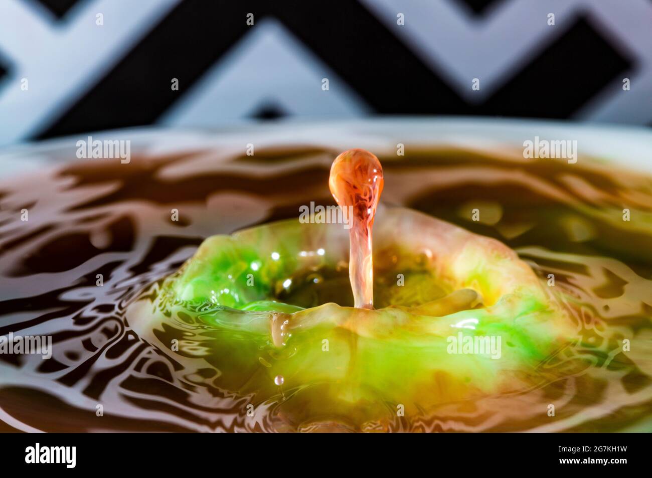 A water drop rebounding from a pool of water to create a beautiful ...
