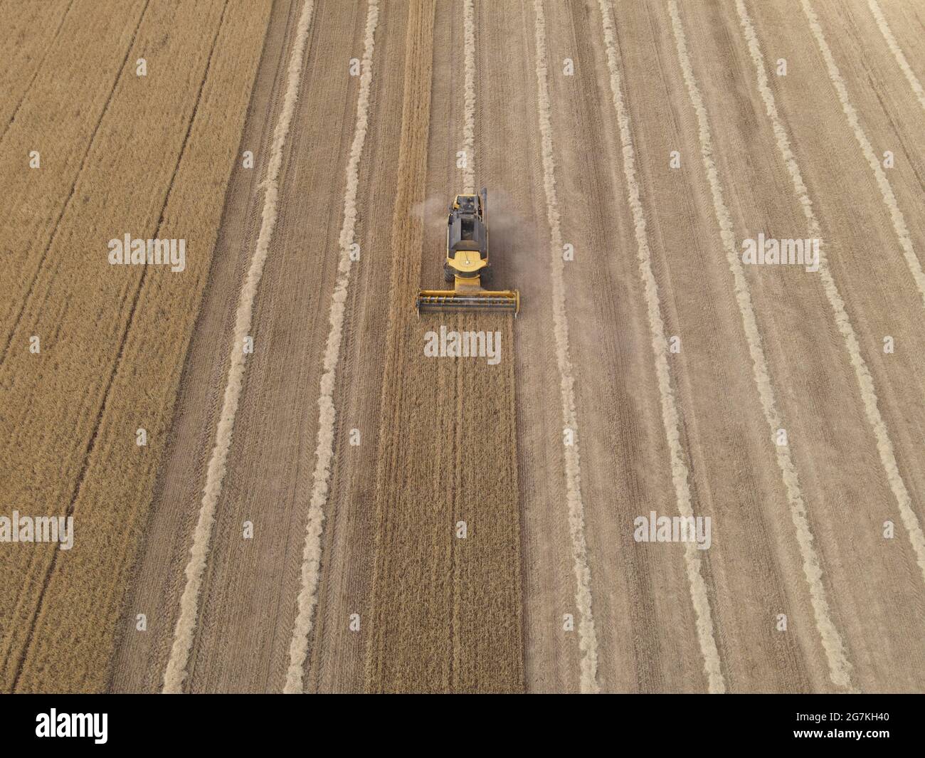 Aerial view of an agriculture machine working on the field Stock Photo ...
