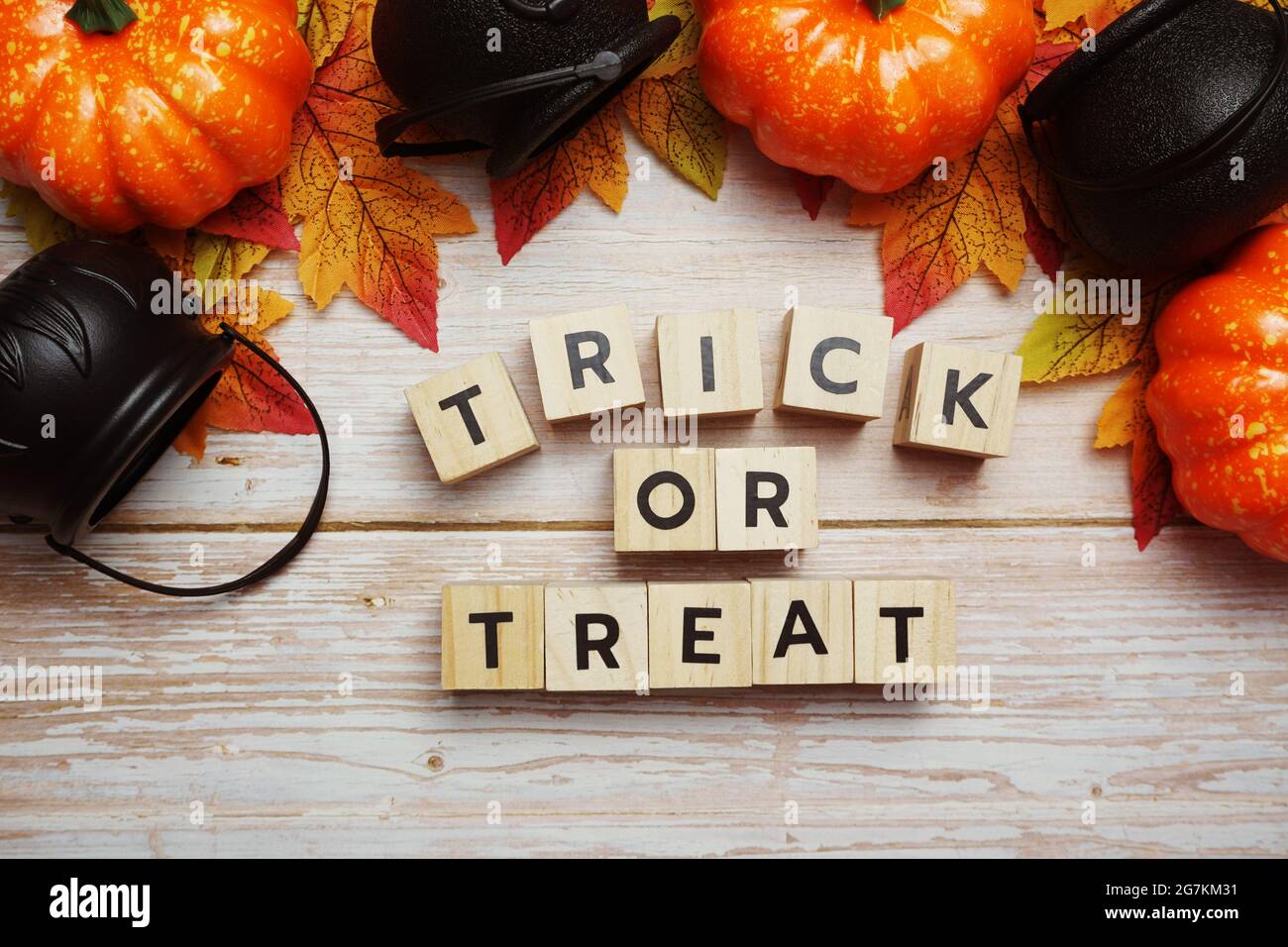 Trick or Treat alphabet letter with Halloween decoration on wooden ...