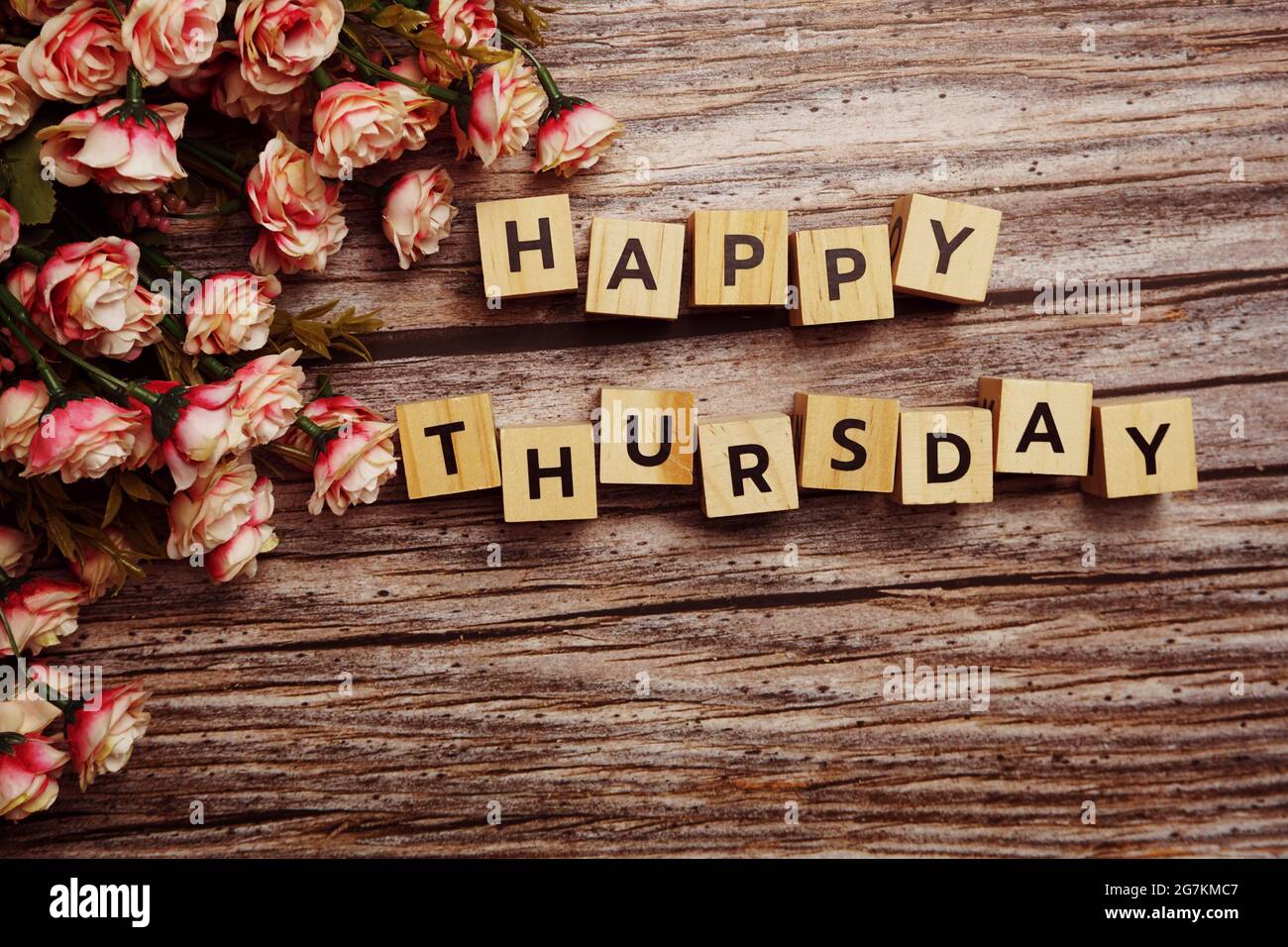 Happy Thursday alphabet letters with flower decoration on wooden ...