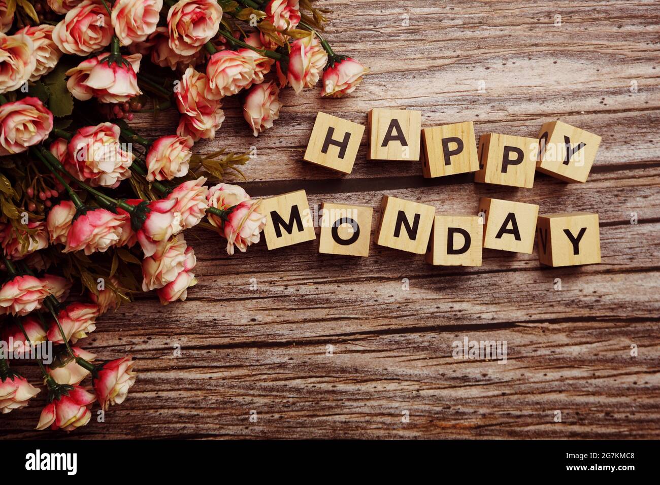 Happy Monday alphabet letters with flower decoration on wooden ...