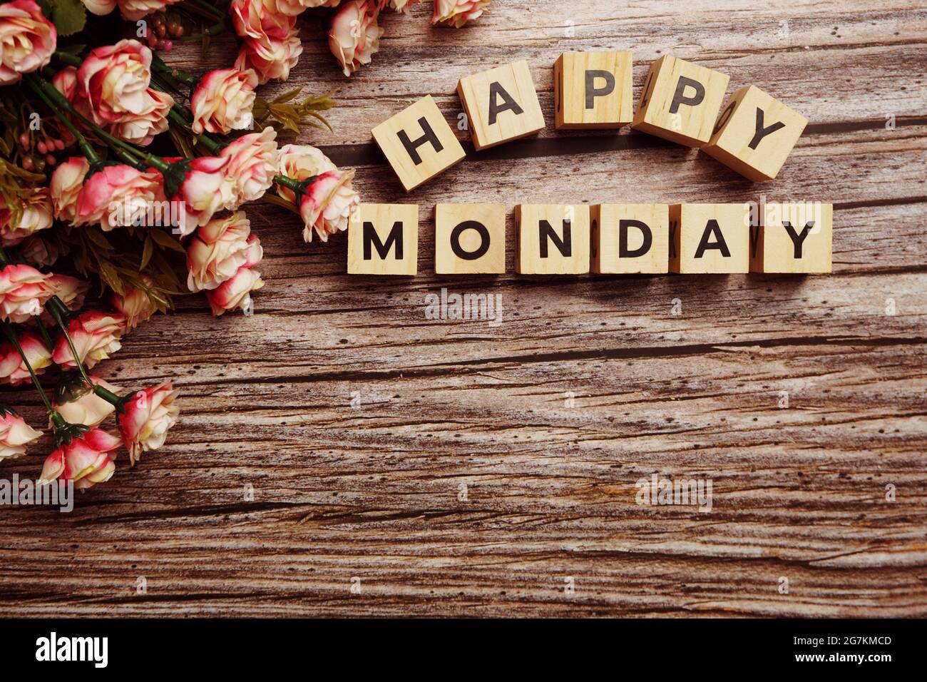 Happy Monday alphabet letters with flower decoration on wooden ...