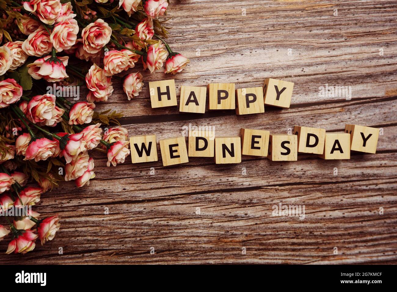 Happy Wednesday alphabet letters with flower decoration on wooden ...