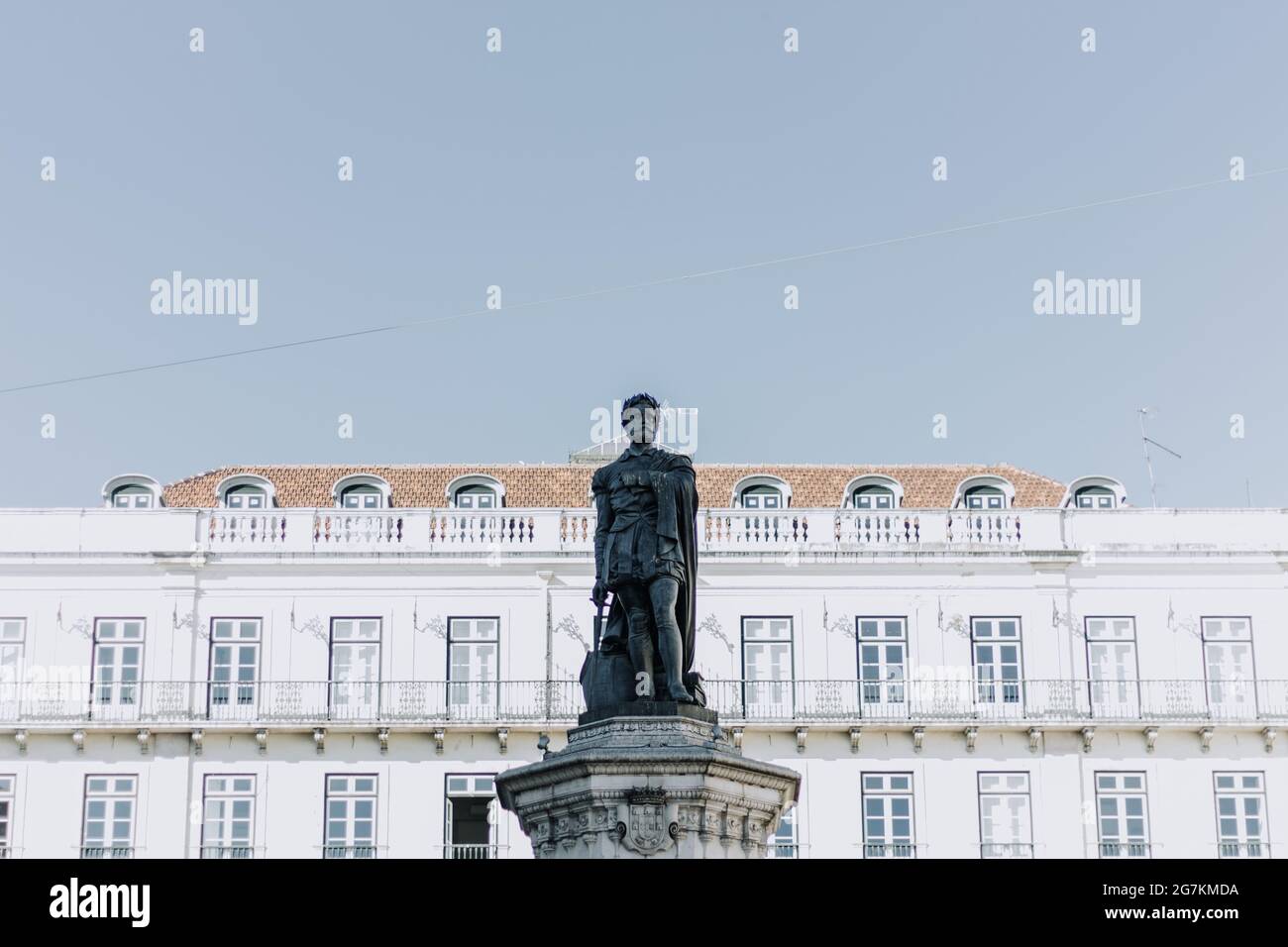 Low angle shot of the Camoes Monument against blue sky in Luis de ...